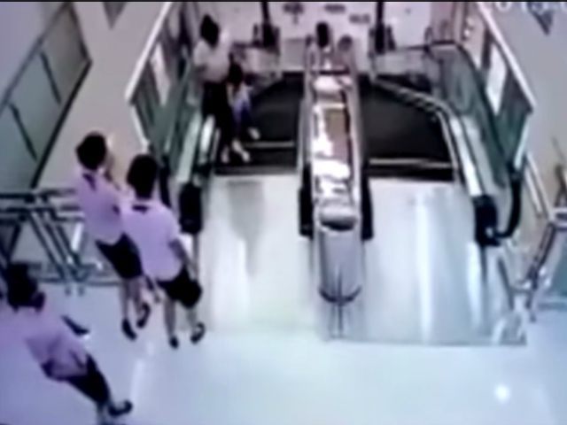 Mom Saves Child Before Falling to Death on Escalator in China