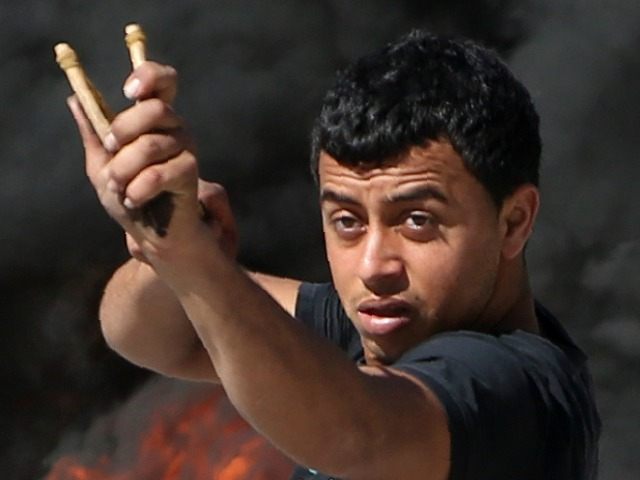 Palestinian Man Throws Rock On Israeli Boy Playing In Spring