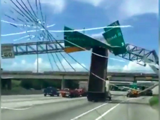 WATCH: Dump Truck Smashes Overhead Signs on Houston Highway