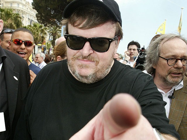Michael Moore Sprays 'Flint Water' at Michigan Capitol, Demands ...