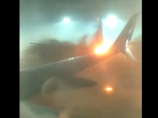 WATCH: Passengers Scream as Plane Next to Them Bursts into Flames