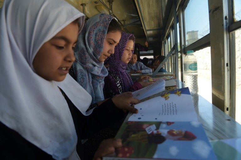 Kabul library bus drives Afghan children to read - Breitbart