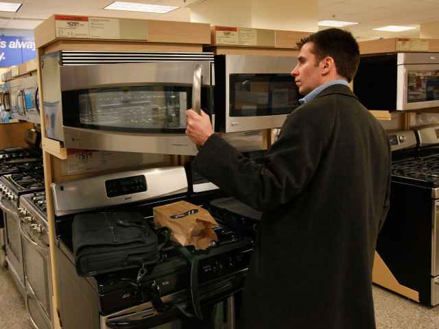 Student Carries Books in Microwave After School Bans Backpacks