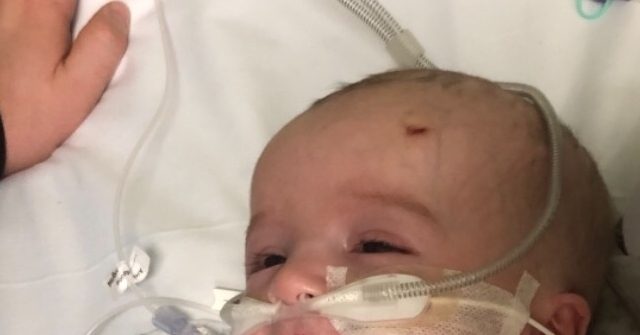 Baby Smiles at Dad After Waking from Medically Induced Coma