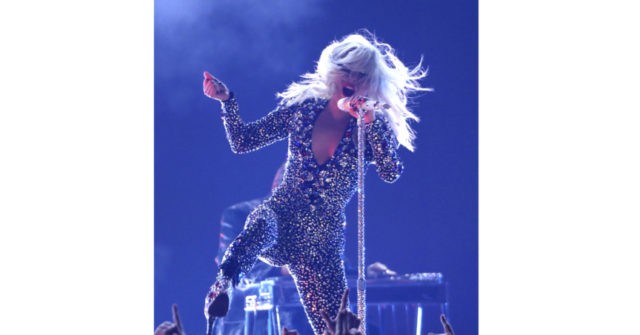 Lady Gaga falls off stage while dancing with fan - Breitbart