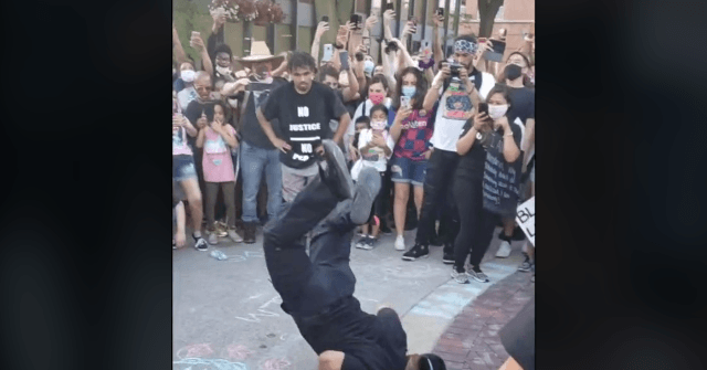 VIDEO: Illinois Cop, Protesters Have a Dance Off at City Hall