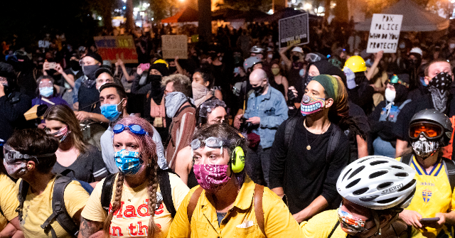 'Wall of Moms' Stand Between Portland Protesters and Federal Officers