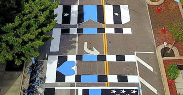 Volunteers Paint 'Back the Blue' Mural Outside Tampa Police Headquarters