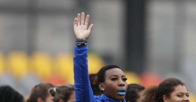 Gwen Berry wins humanitarian award, insists US can do better - Breitbart