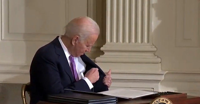Watch: Joe Biden Struggles to Put His Pen in His Pocket