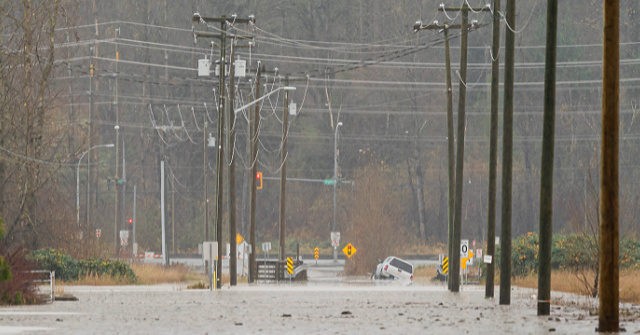 WATCH: Man Helps Saves Dozens from Raging Floodwaters Using Tractor