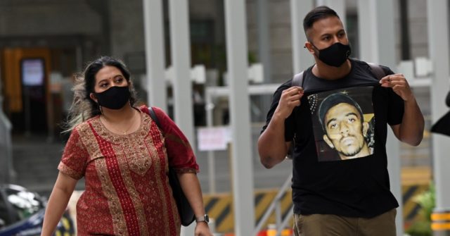 Rapper who alleged Singapore racism charged with fanning tensions ...