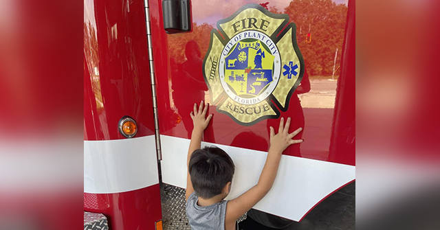 WATCH - Firefighter Helps Blind Child 'See' His Gear: 'Heart of Gold'