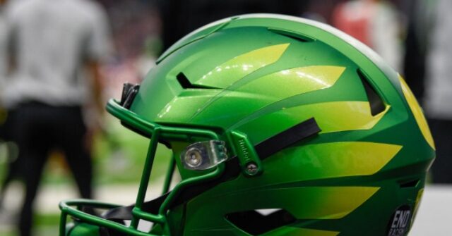 WATCH: Oregon Player Appears to Punch Oregon State Fan
