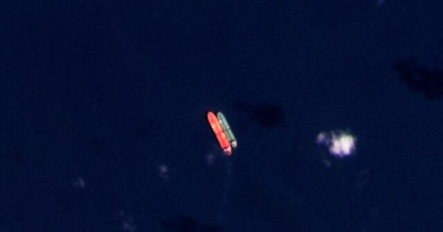 A tanker believed to hold sanctioned Iran oil starts offloading near ...