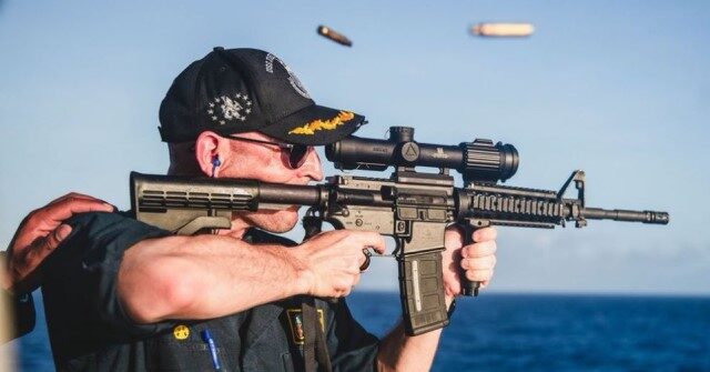 Navy Mocked for Photo of Commander with Rifle Scope Mounted Backward
