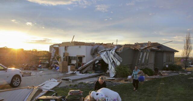 Residents begin going through the rubble after tornadoes hammer parts of Nebraska and Iowa ...