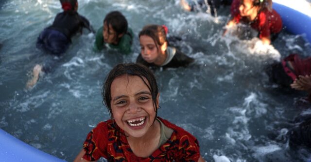 Mobile pools offer relief from heat to children in north Syria camps ...
