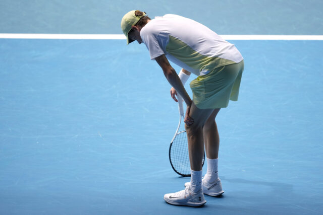 Jannik Sinner gets past Holger Rune at the Australian Open in a match with net and medical ...