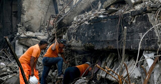 Pakistan rescuers scour blaze site for dozens missing - Breitbart