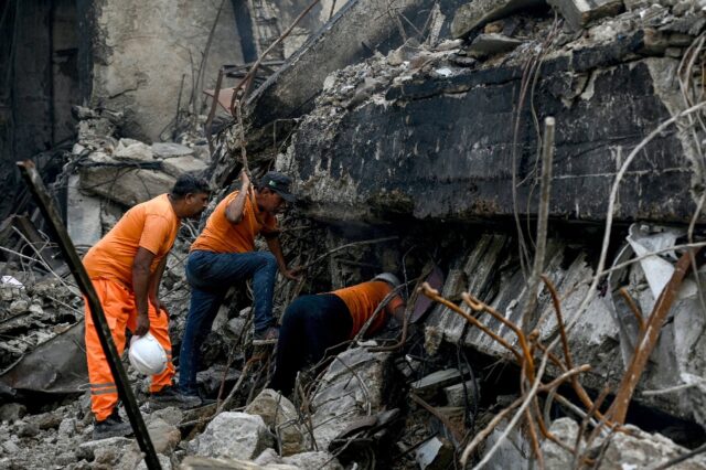 Pakistan rescuers scour blaze site for dozens missing - Breitbart