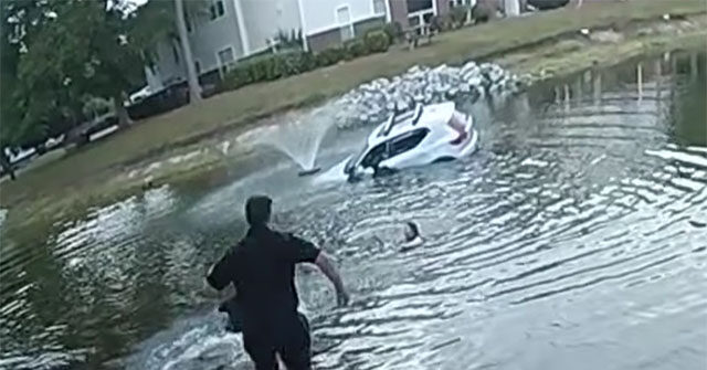 WATCH: Police Rescue Unconscious Driver from Car Sinking in Pond